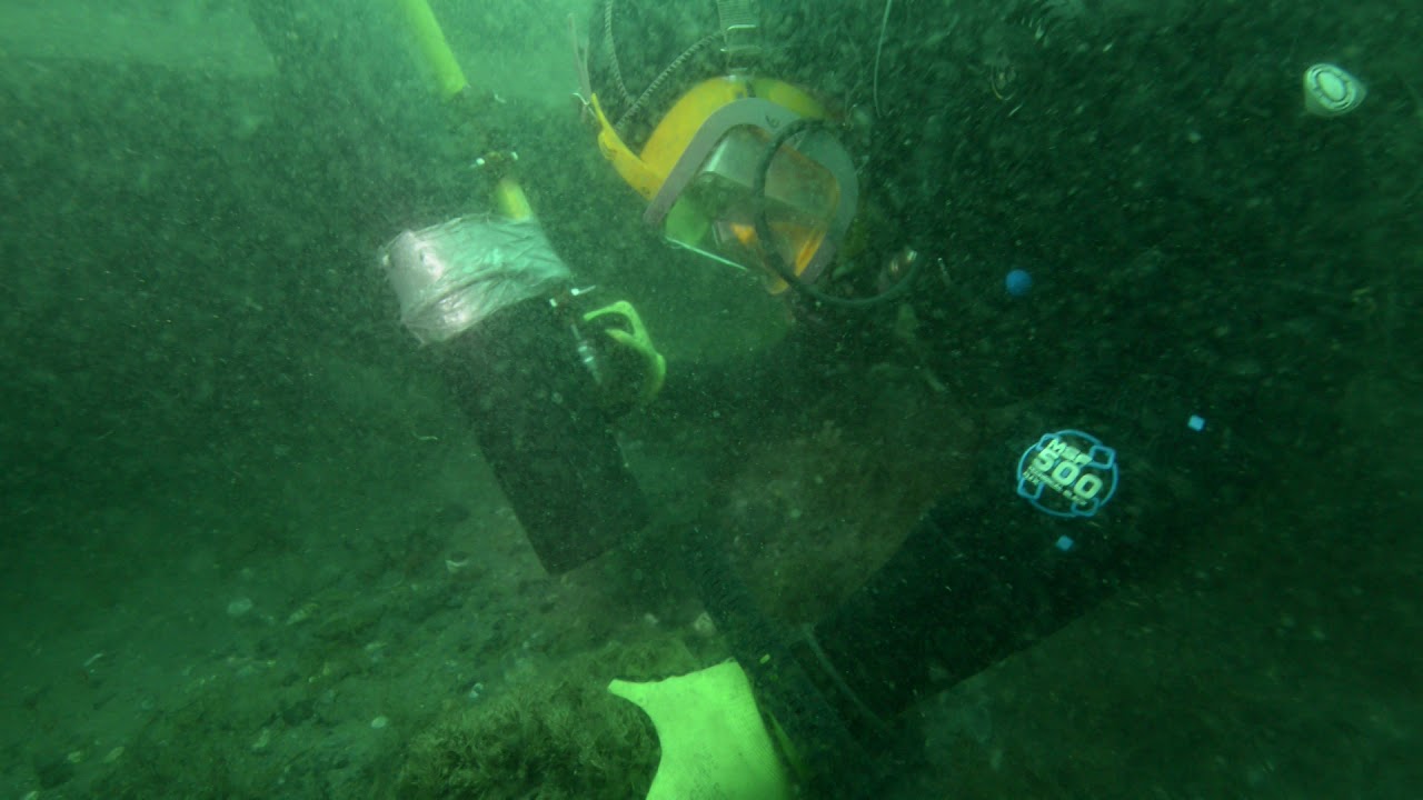 Excavating gun wadding from invincible 1744 - YouTube