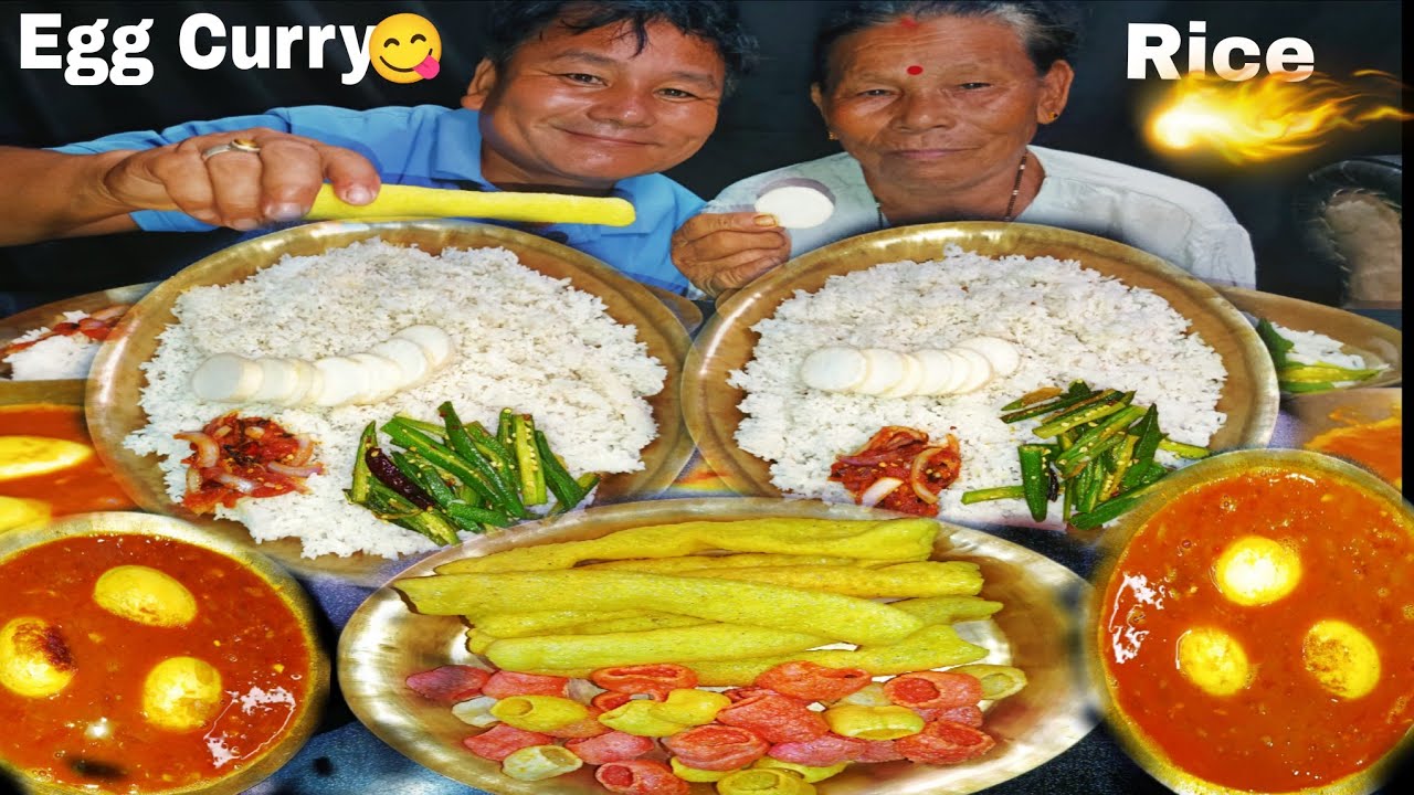 Eating Egg Curry, With Rice, Lady Finger, Tomato Pickle, Radish Salad ...