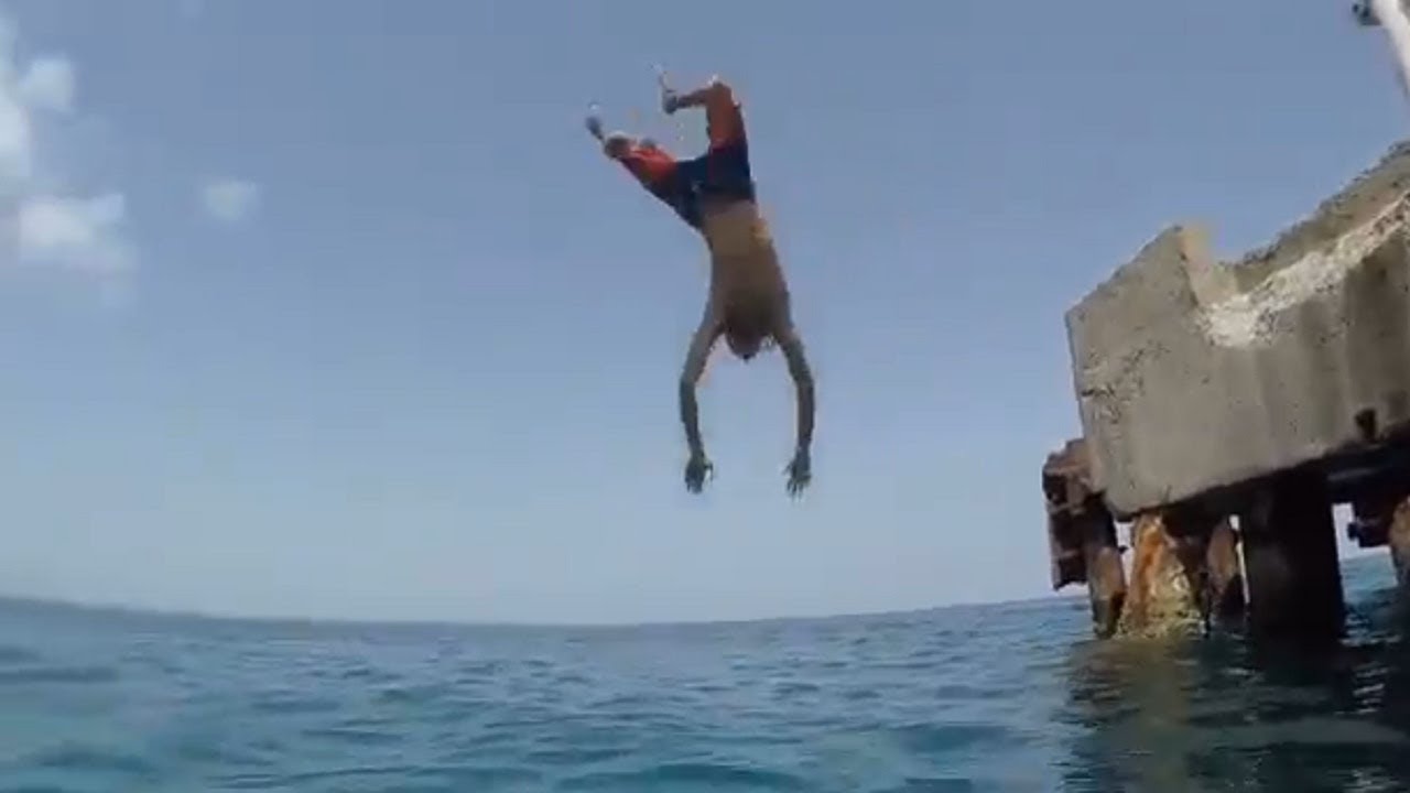 Guy Does A Back Flip Into The Water And Lands On His Stomach - YouTube