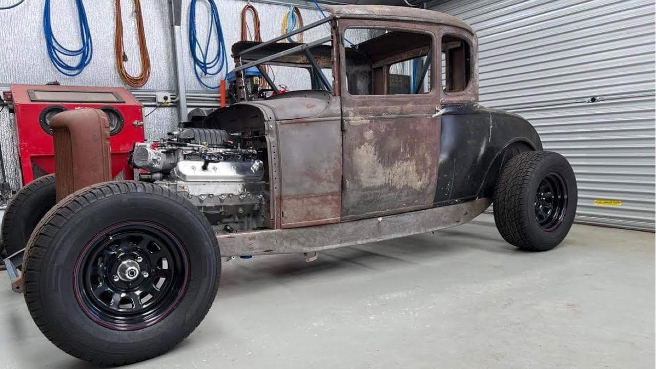 Model A coupe on 1932 rails, doing the rear kick up on the chassis ...