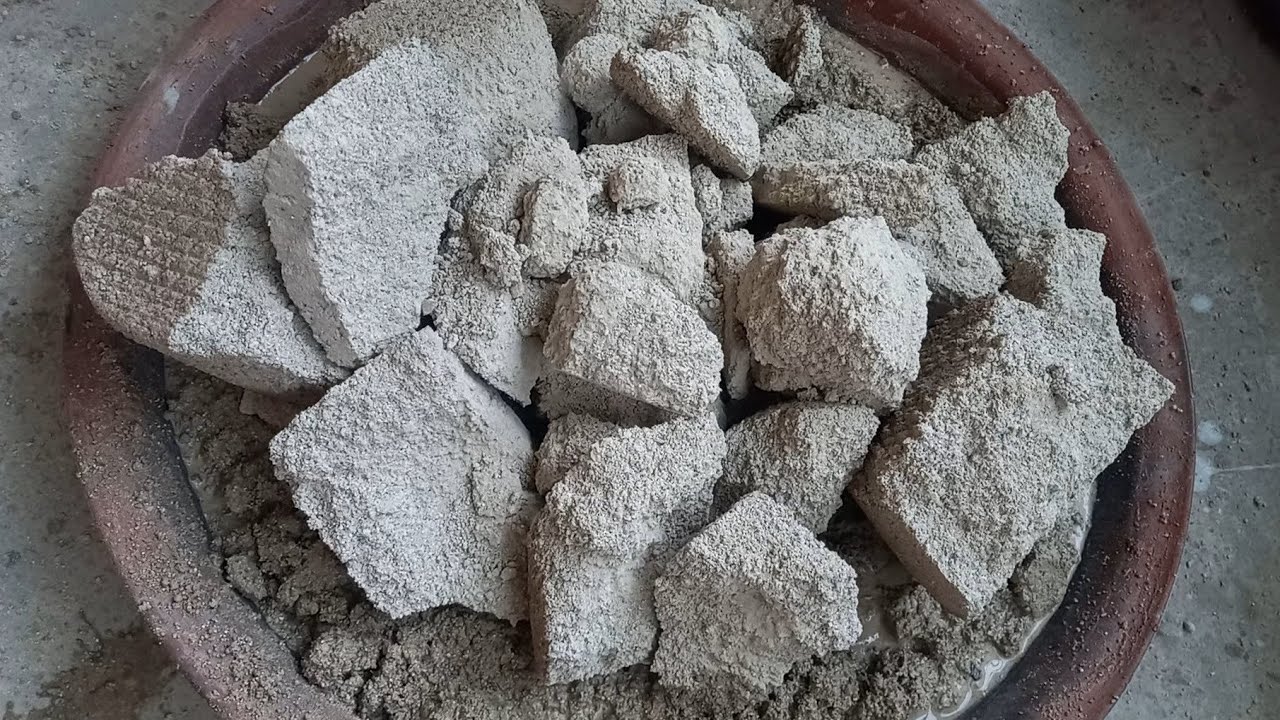 dusty crunchy sand cement crumbling crumbling in steal pot dry water ...