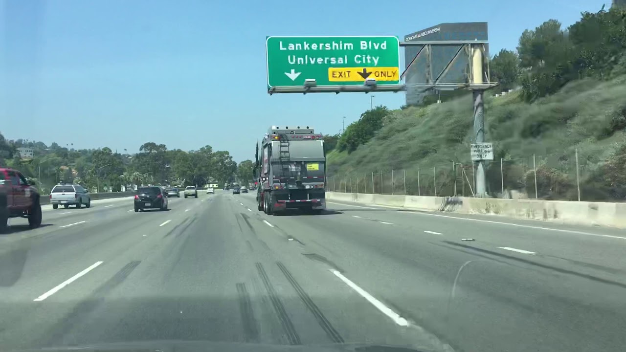Garbage Truck Dropping Trash on the Los Angeles Highway - YouTube