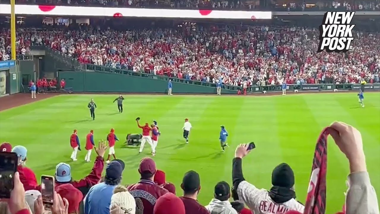 Phillies fan gets tackled hard by security guard after charging field ...