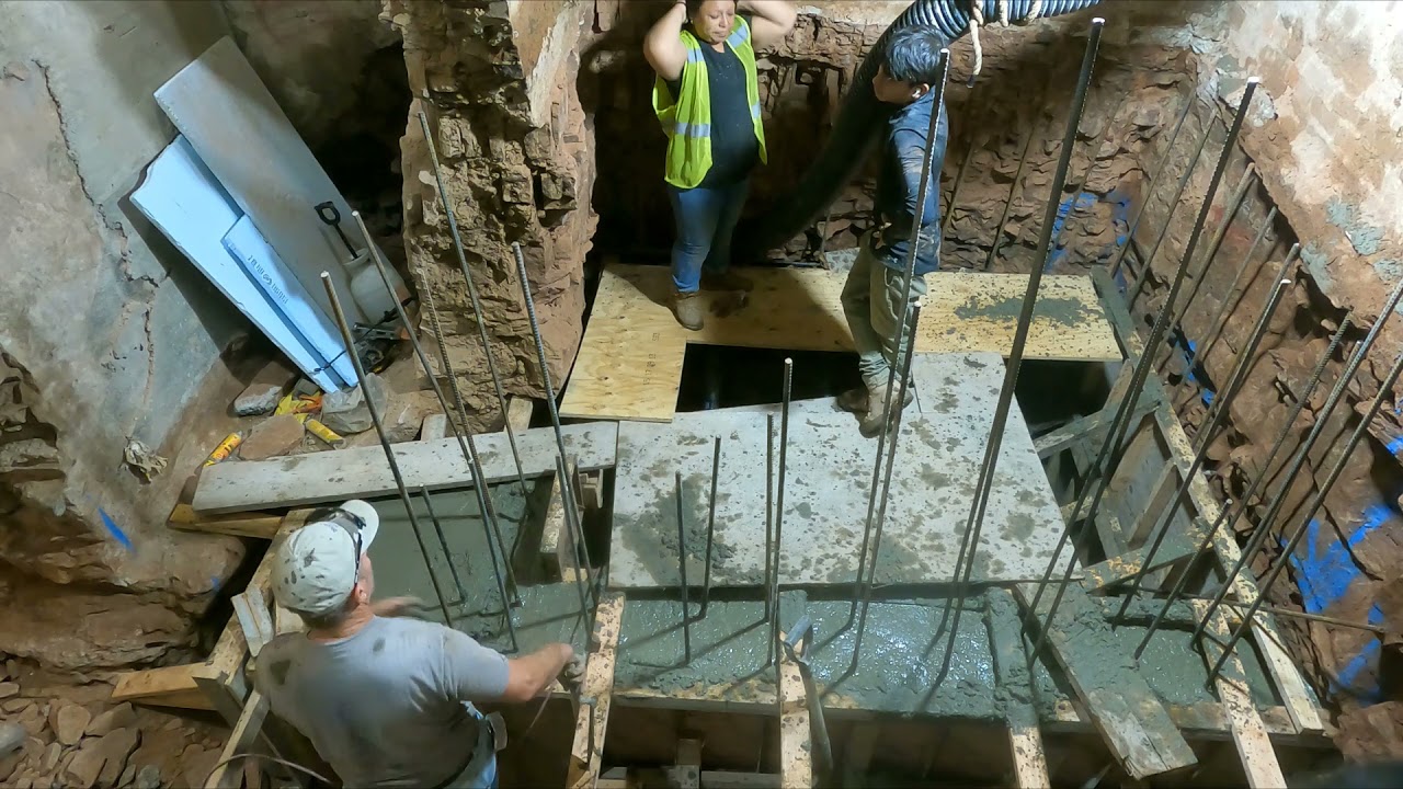 Forming and pouring concrete in elevator shaft - YouTube