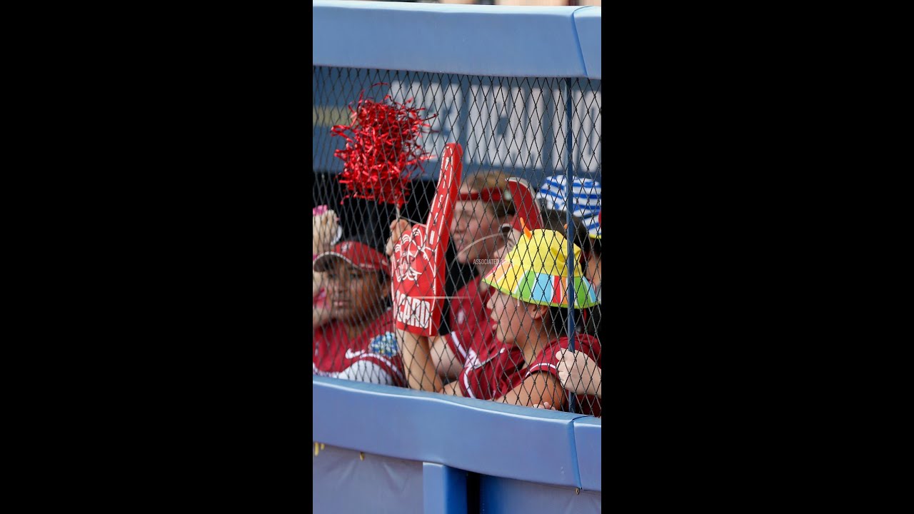 College softball players bring fun cheers to a fierce sport - YouTube