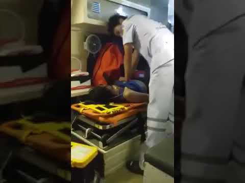 Woman gets CPR on a stretcher
