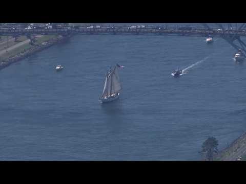 Ships traverse the Cape Cod canal en route to Sail Boston