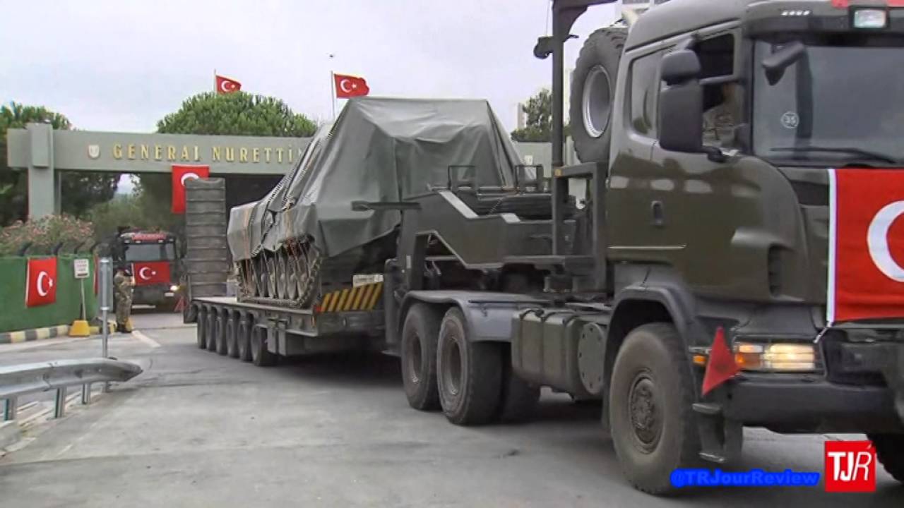 Military trucks with the Turkish national flag transport tanks to near ...