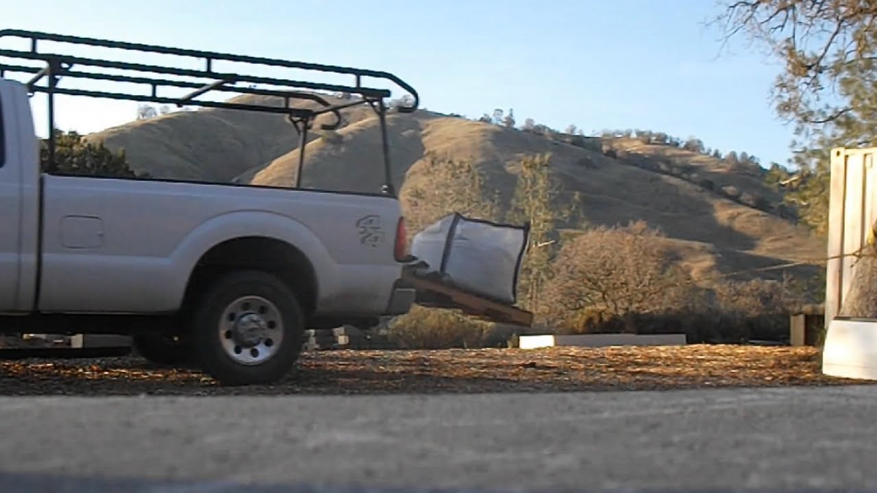 Quickly Unloading a Yard Bag of Bulk Sand from F250 Truck - YouTube