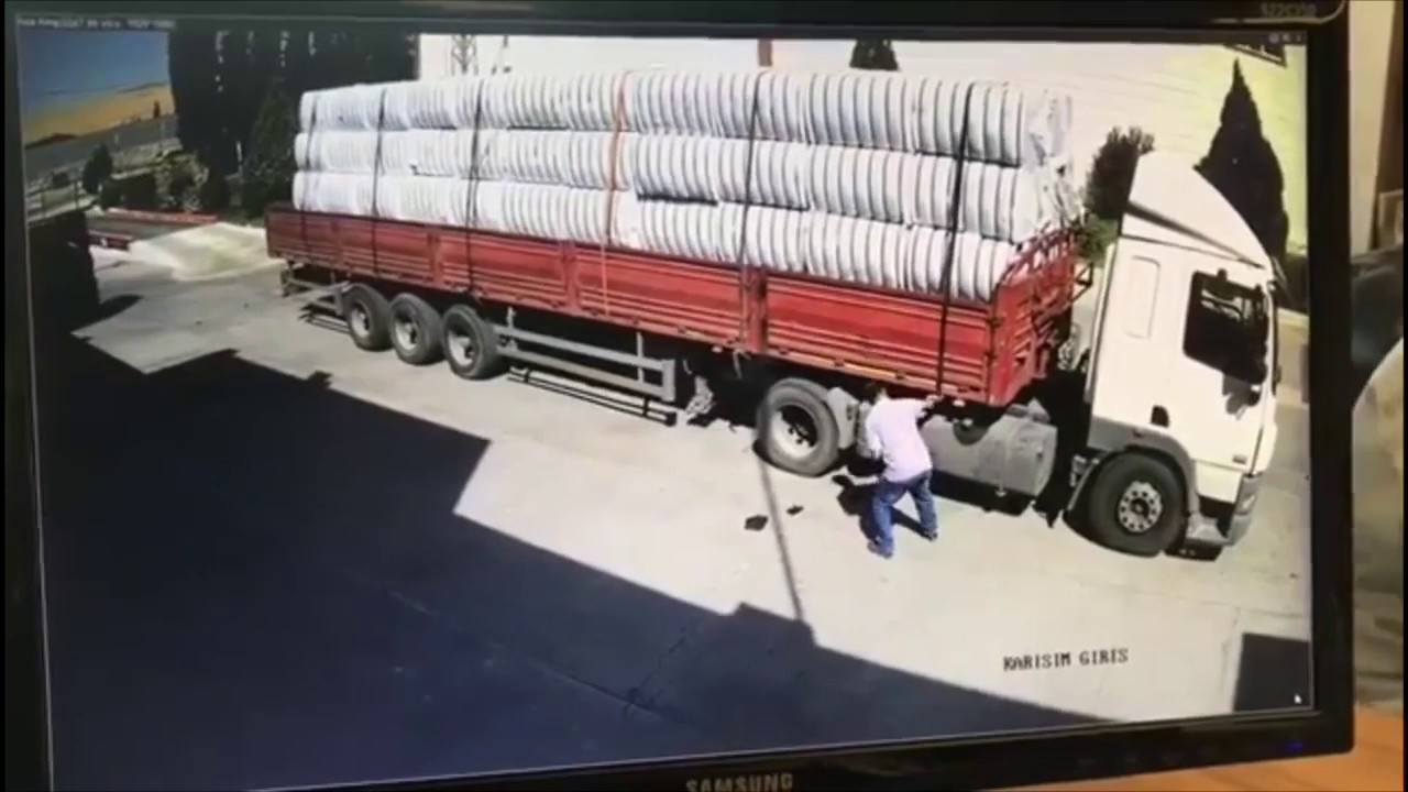 Truckers load falls on top of him - YouTube