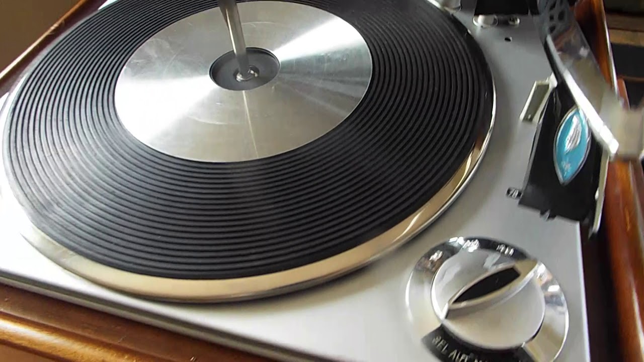 RCA 4 speed automatic record changer playing a stack of 45's. - YouTube