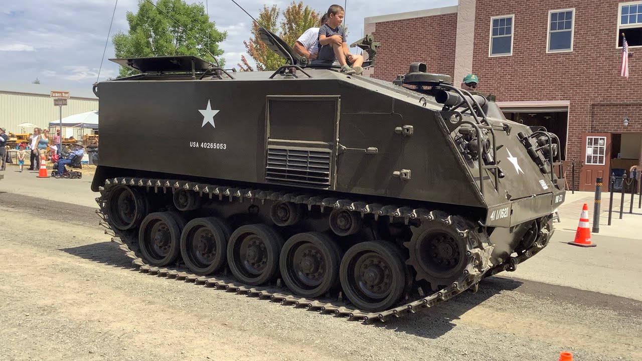 Cold War era M75 Armored personnel carrier (apc) leads a parade of ...