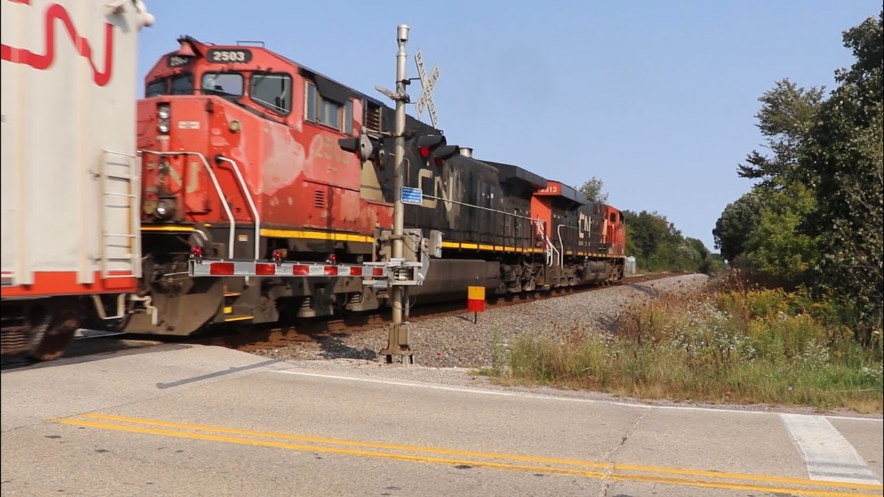 CN 2503 C44-9CWL trails on CN Q199 w/defect detector at Lawnsdale rd ...