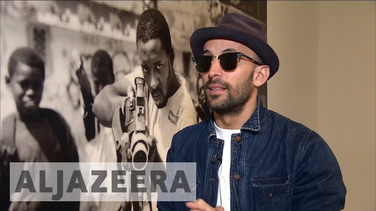 Artist JR's work showcased in Qatar - YouTube