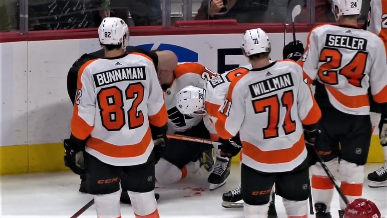 Gerald Mayhew Goes Hard Into The Boards Head First Littering The Ice ...