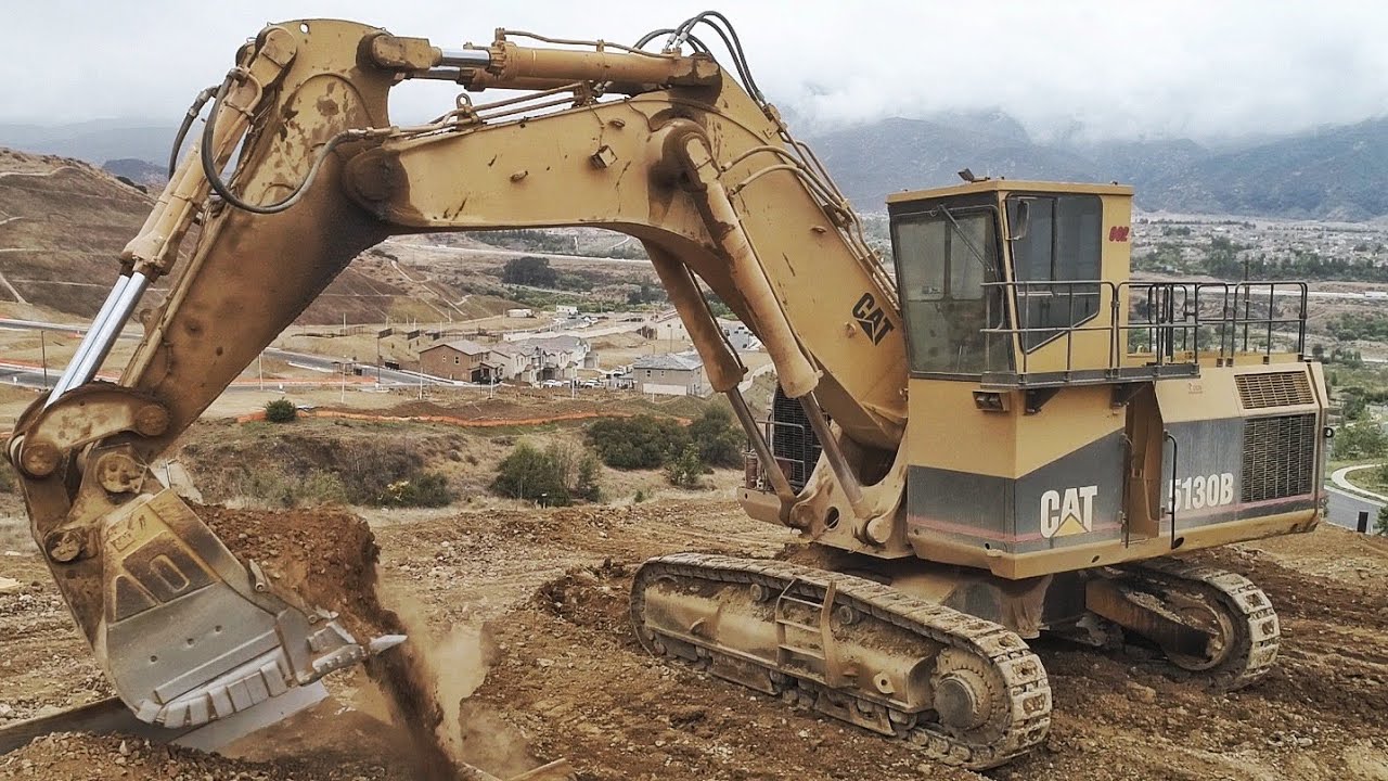 Massive 200 Ton Cat Excavator Loading Trucks. - YouTube