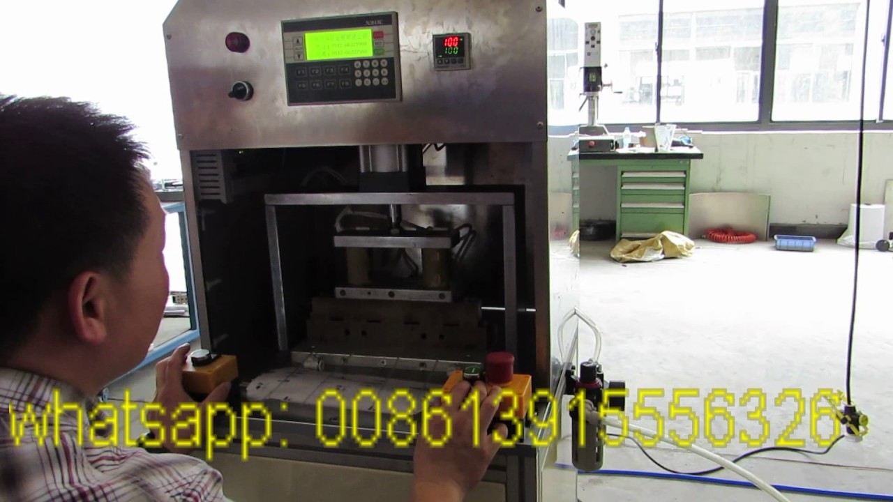 Catheter cold punching machine - YouTube