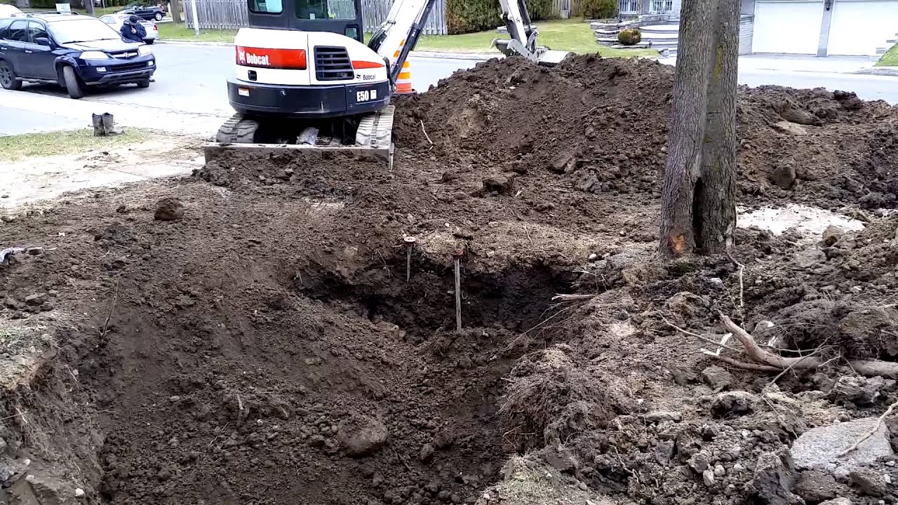 Bobcat E50 Backfilling New Sewer Line - YouTube