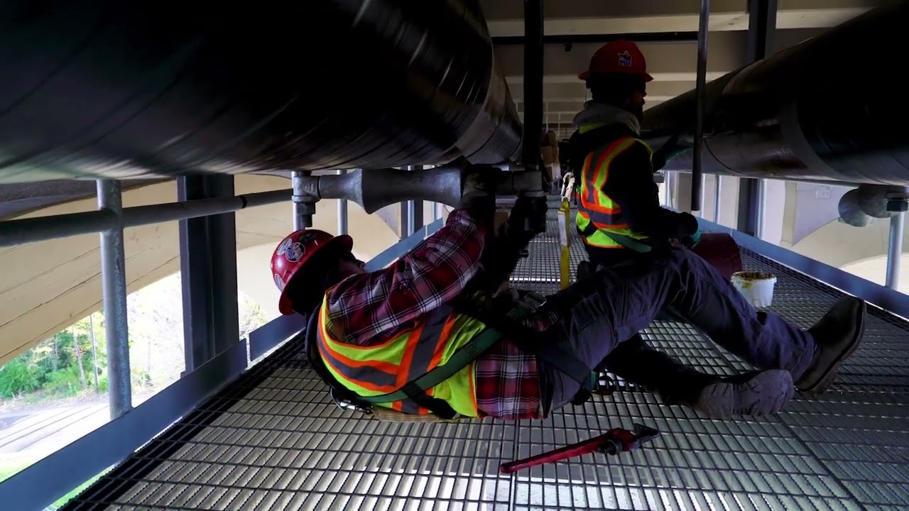 Michels Utility Services team builds twin utility lines under a bridge ...