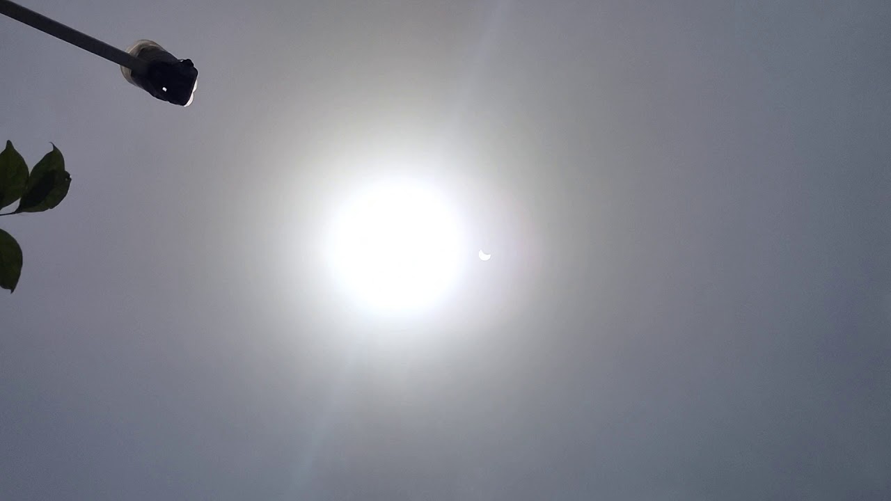 Watch Solar Eclipse Reflection on The Sun Rays. - YouTube