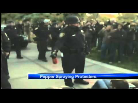 Cop pepper sprays student protesters - YouTube