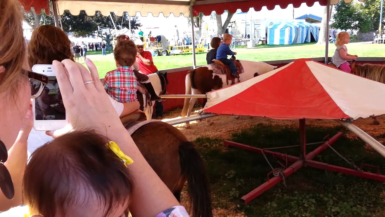 Ezra's first pony ride at the fair - YouTube