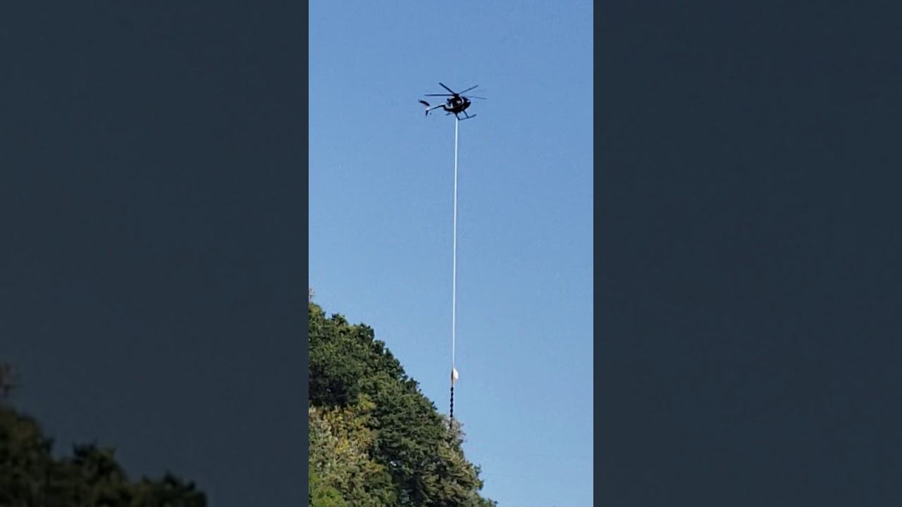 Helicopter trimming trees - YouTube