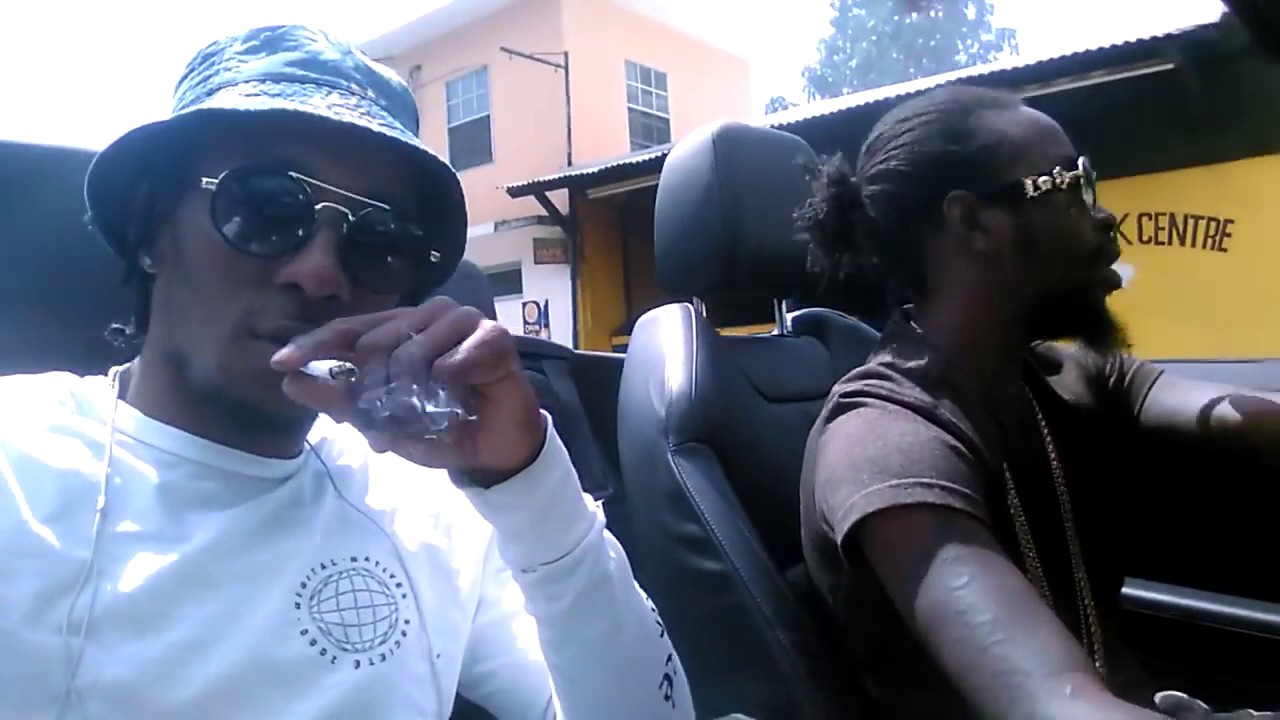 Popcaan Listening To Aidonia Songs In His New Convertable Range Rover ...