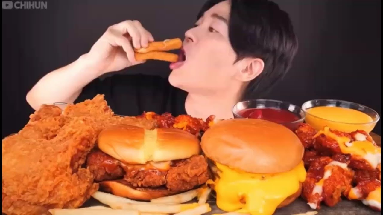 Eating Crispy Chicken With Spicy Zinger Burger And French Fries ...