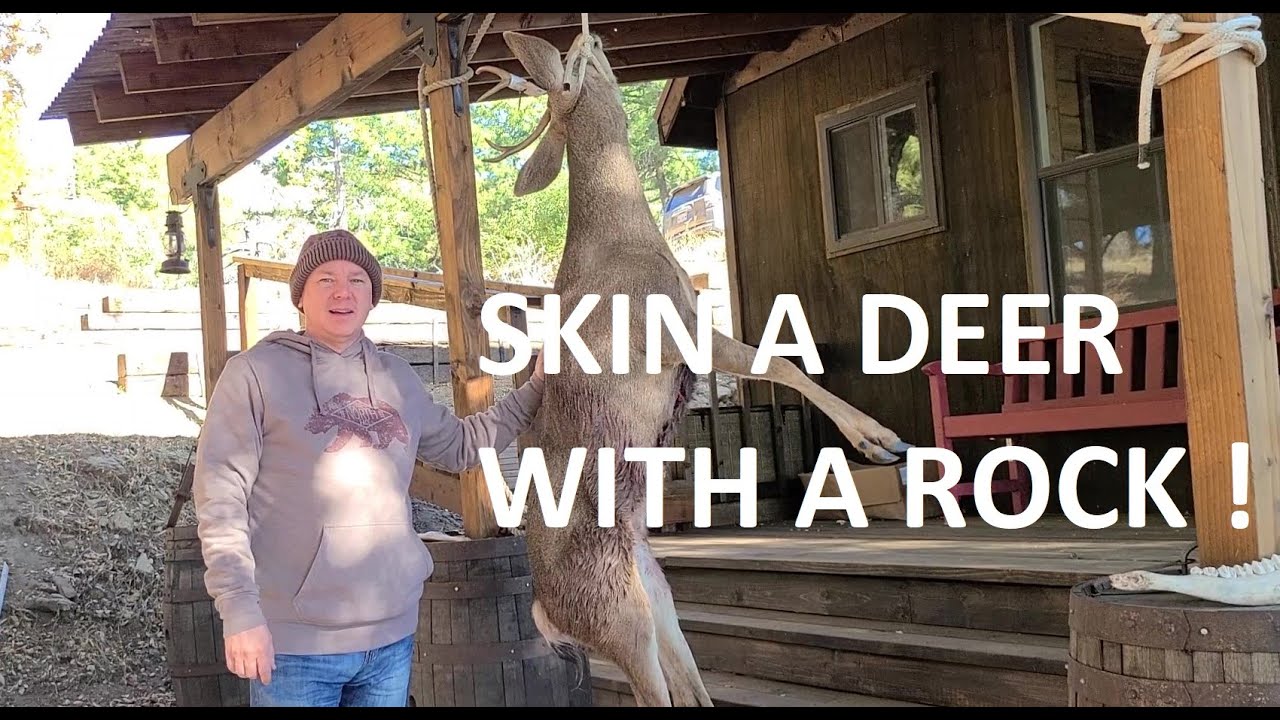 How to skin a deer with a Rock and a ATV. - YouTube