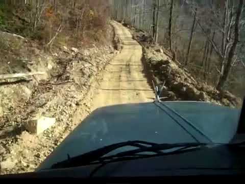 Hauling logs off a mountain with death at every angle. Real TruckDriver ...