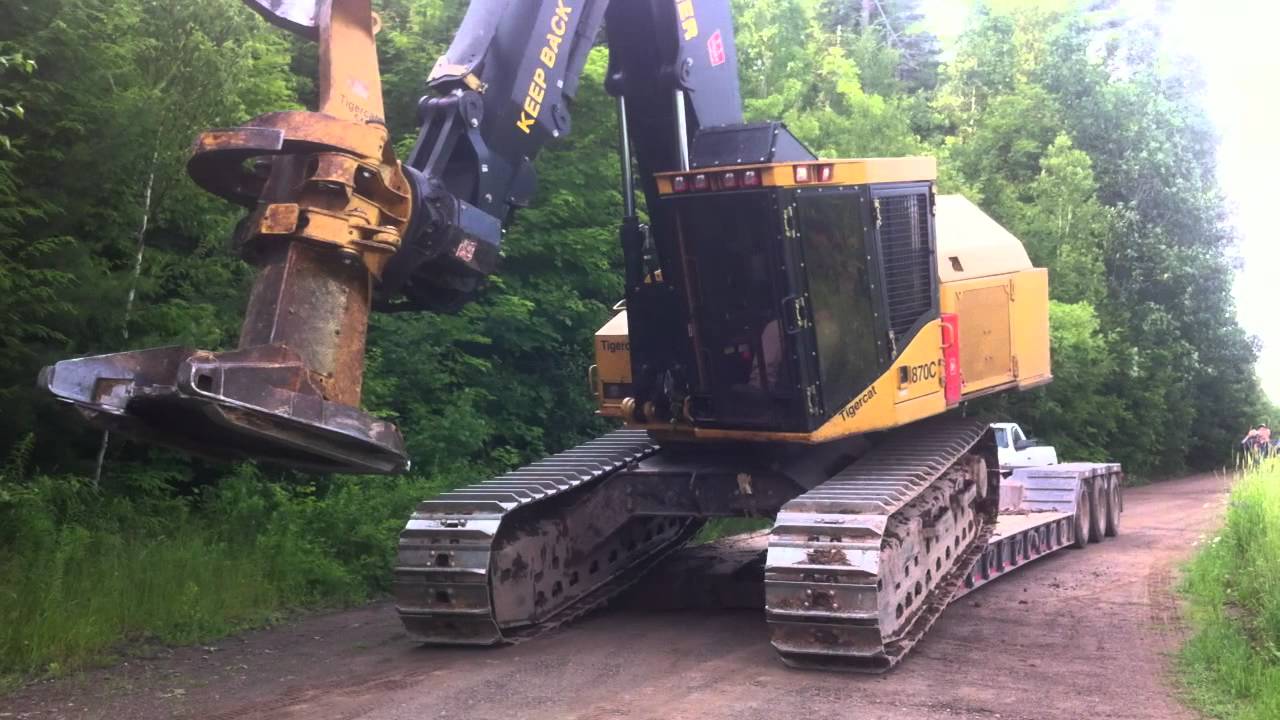 870 Tigercat unloading. - YouTube