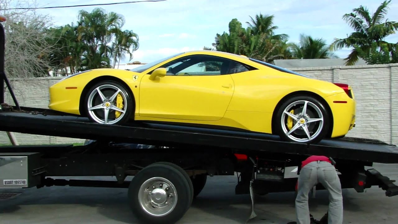 yellow Ferrari 458 Italia being loaded on a tow truck - YouTube