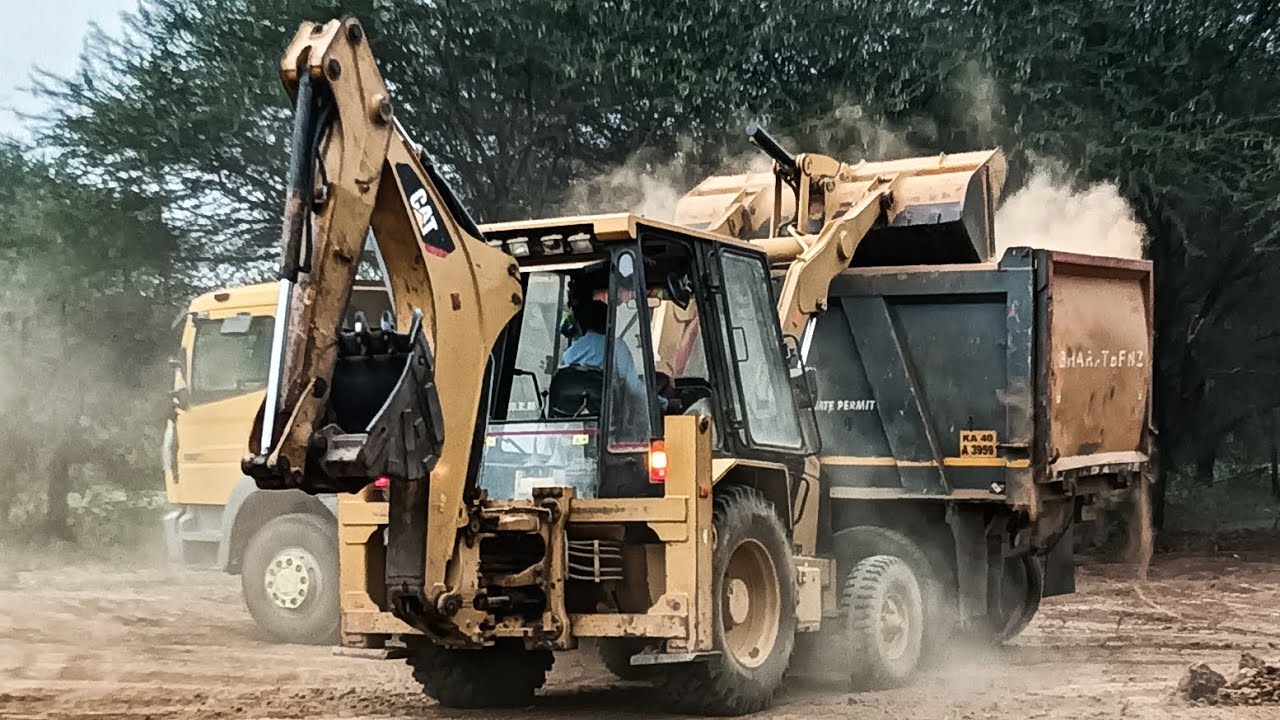 front bucket loding cat machine Benz tipper - YouTube