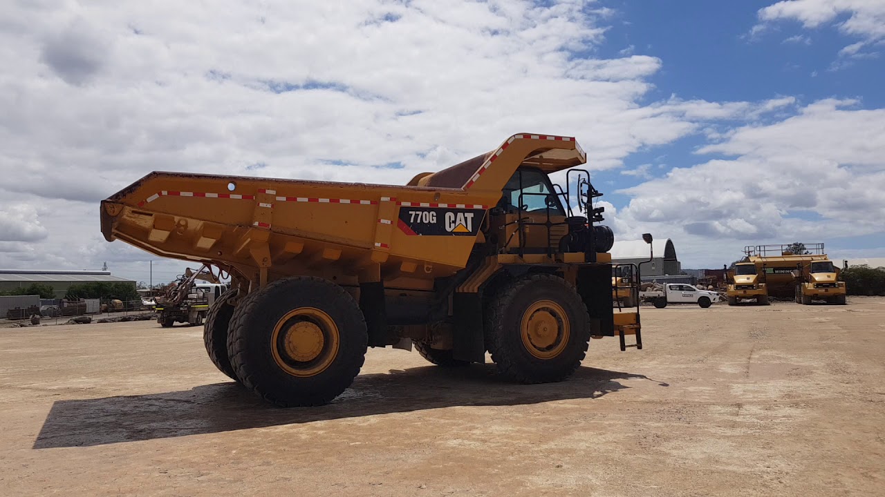 Caterpillar 770G Dump trucks - YouTube