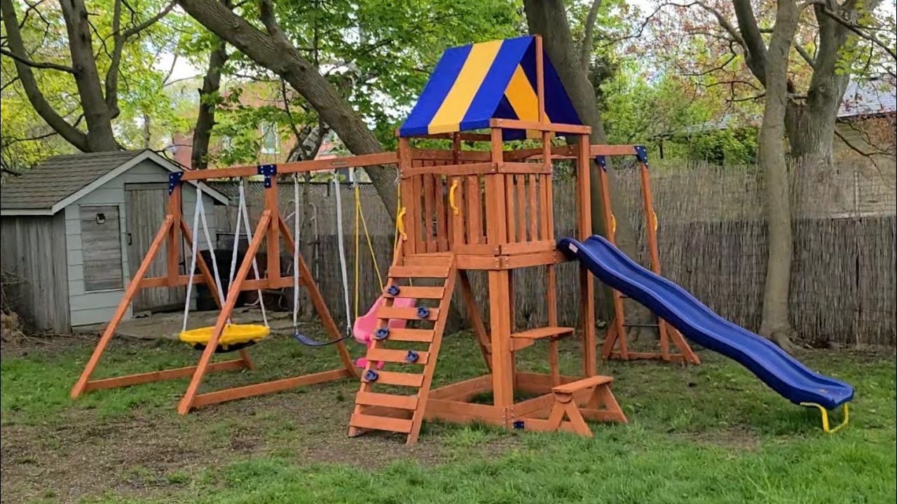 Assembling a Wooden Kids Playground with a slide & swingset - YouTube