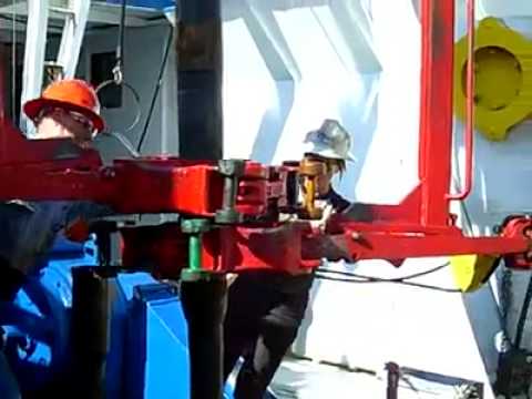 Woman on a drilling rig making connections - YouTube