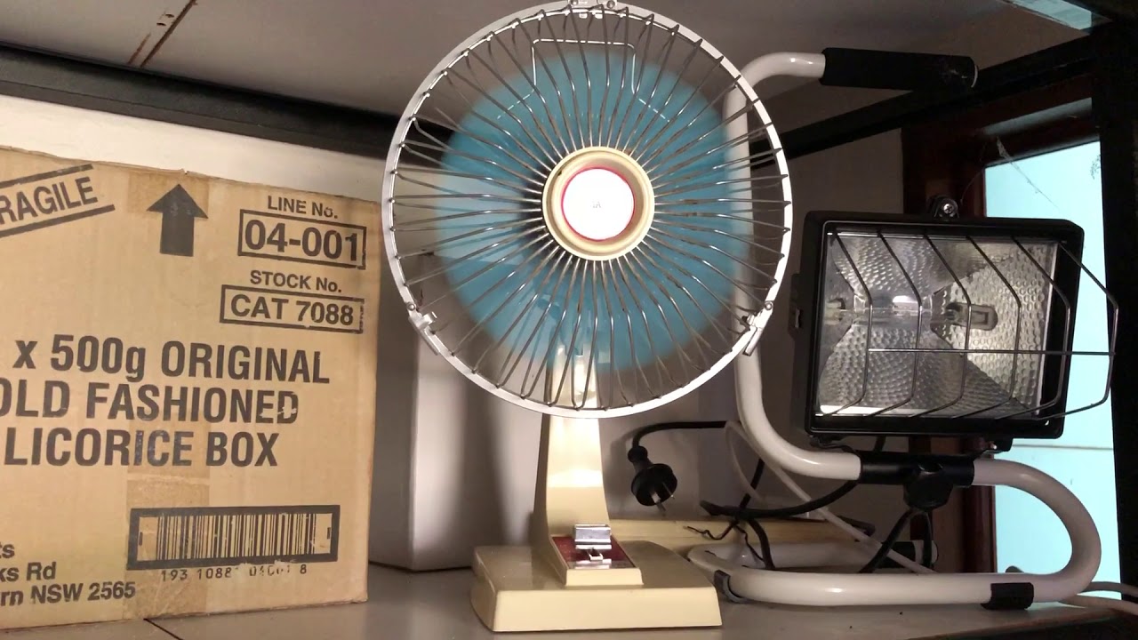 A little blue fan in a outside coubord - YouTube