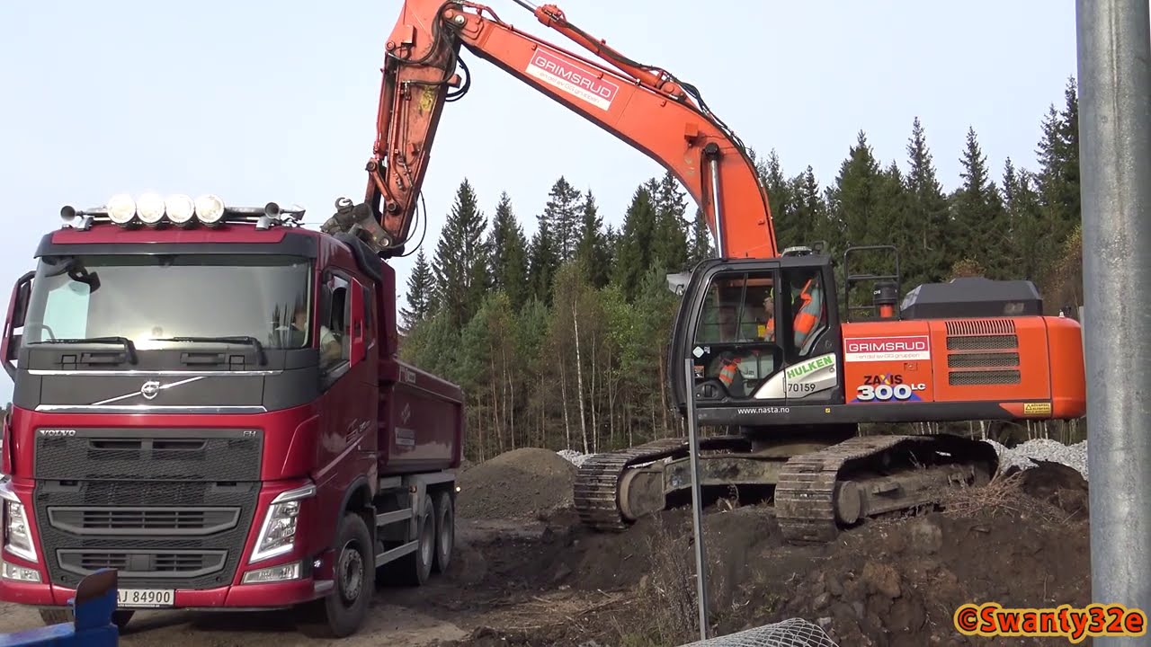 4K| Hitachi Zaxis 300LC With Tilt Bucket Digging And Loading Volvo FH ...