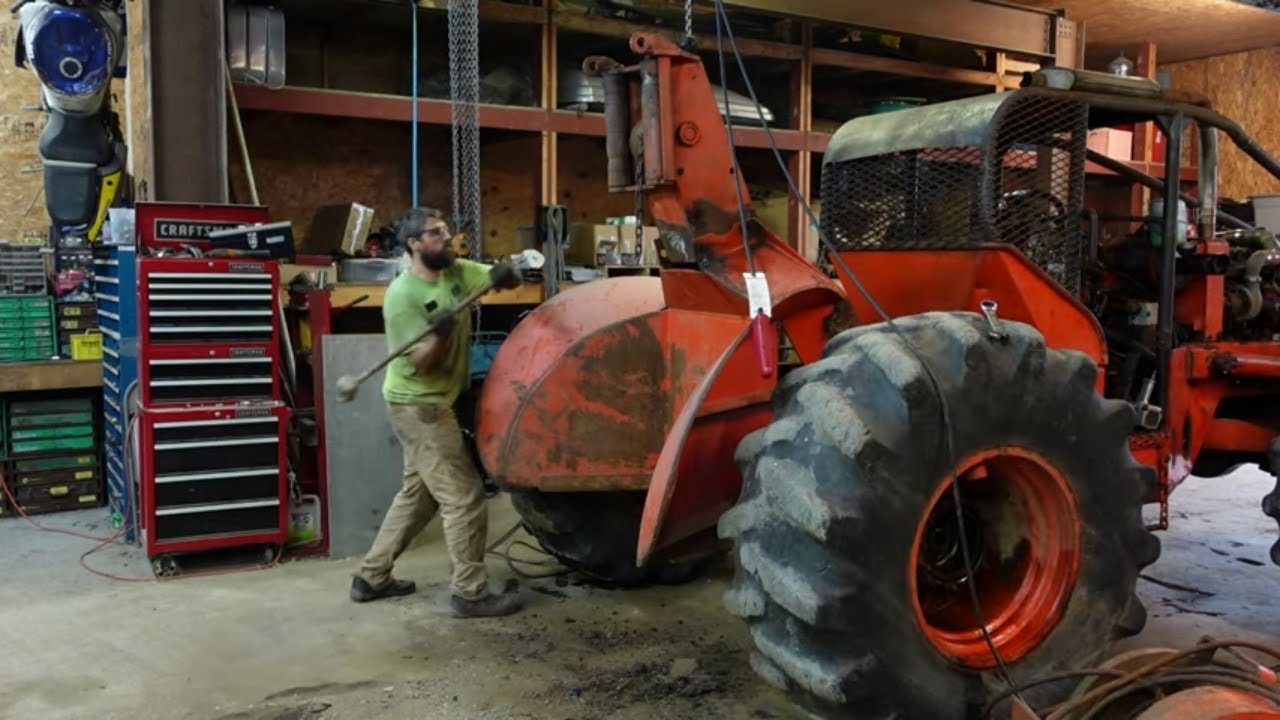 Pulling the fairlead and winch from the Timberjack 360 Skidder - YouTube