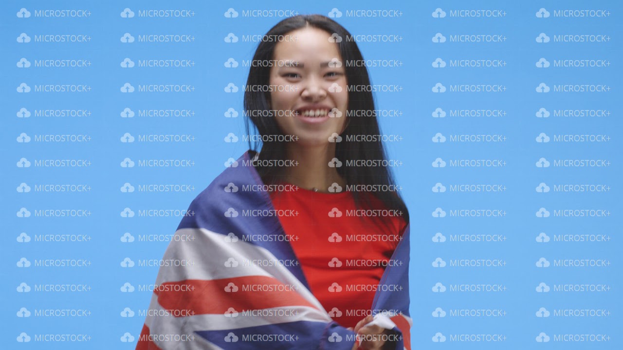 Young woman wrapped in and dancing with union jack - YouTube