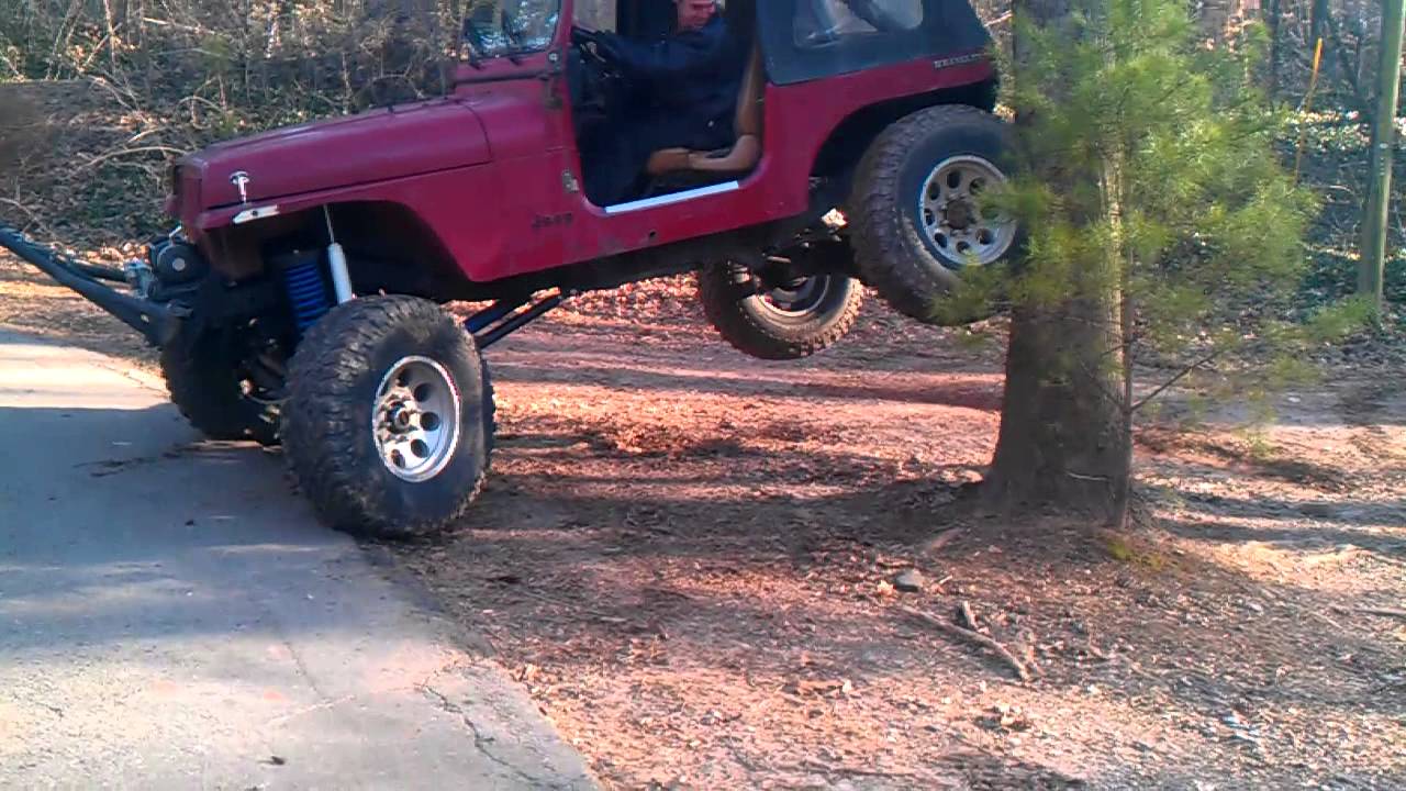 Jeep yj in a tree - YouTube