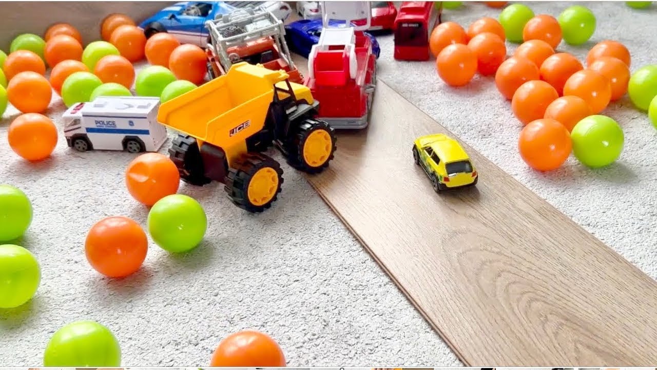 Toy Cars Sliding Into Colorful Balls Pit - YouTube