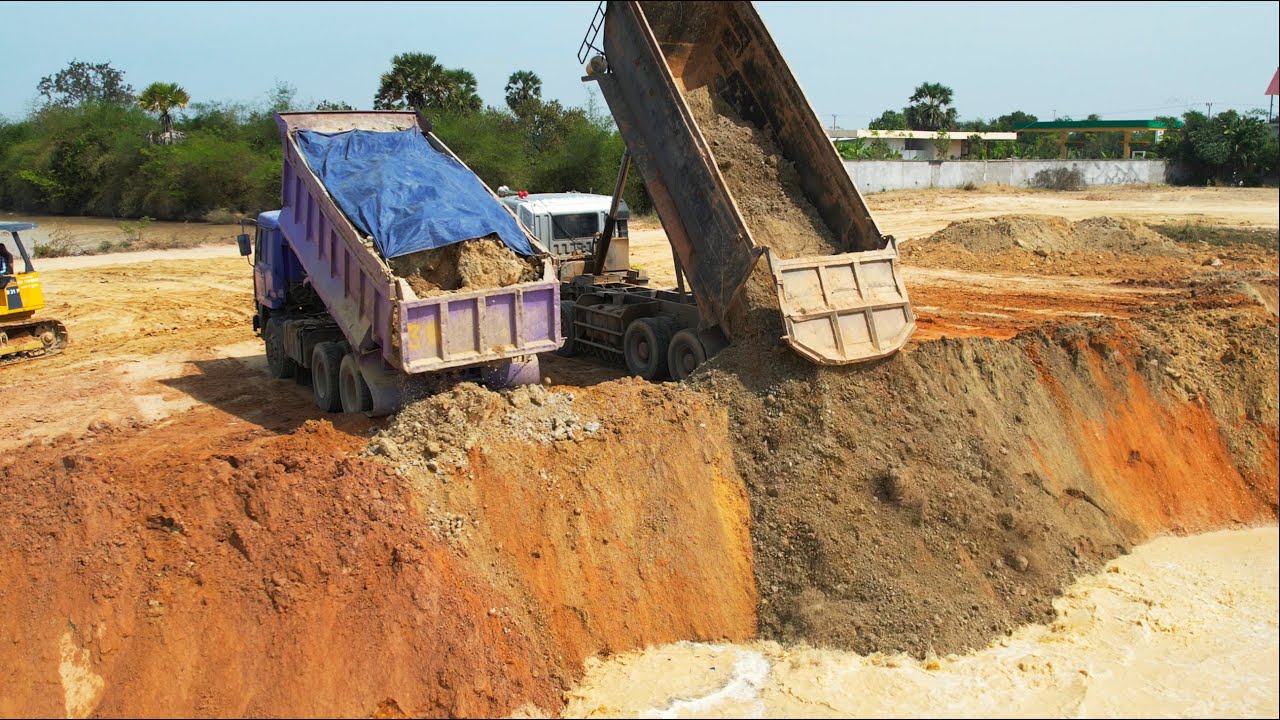Amazing Dump Trucks Dumping Soil Auto Into Water Landslide And ...