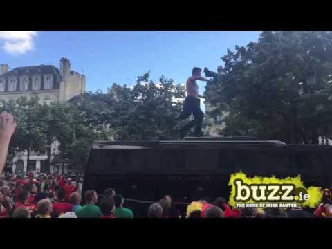 Irish fan dances topless on bus