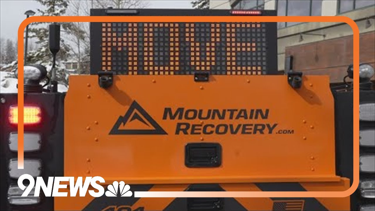 Tow truck company installs signs for travel safety - YouTube