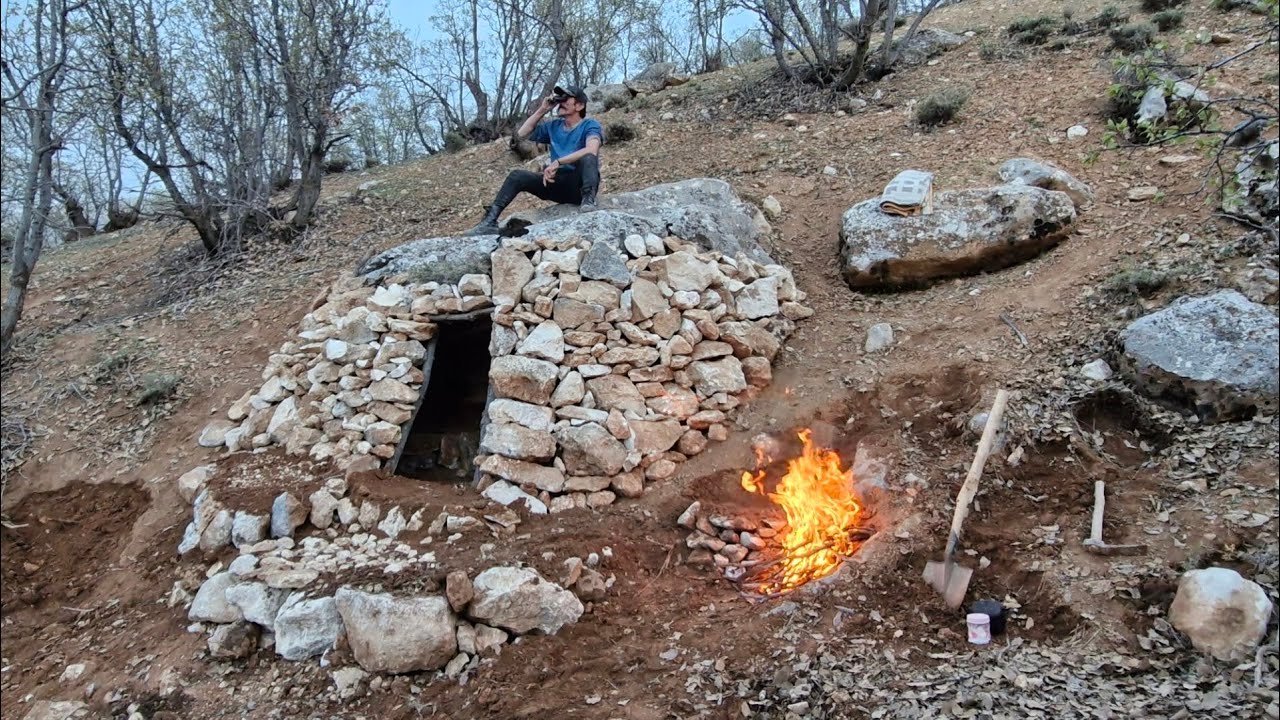 Building a Cozy Stone Shelter with Fireplace Under a Giant Rock ...