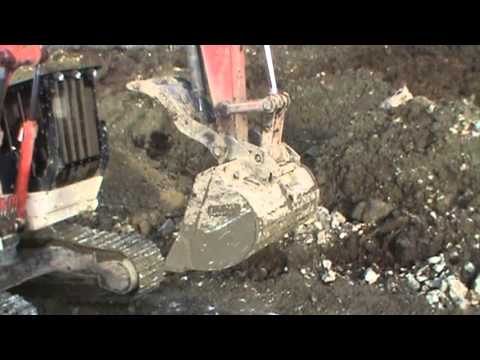 Link Belt 290 X2 roadbuilder excavator cleaning up a quarry - YouTube