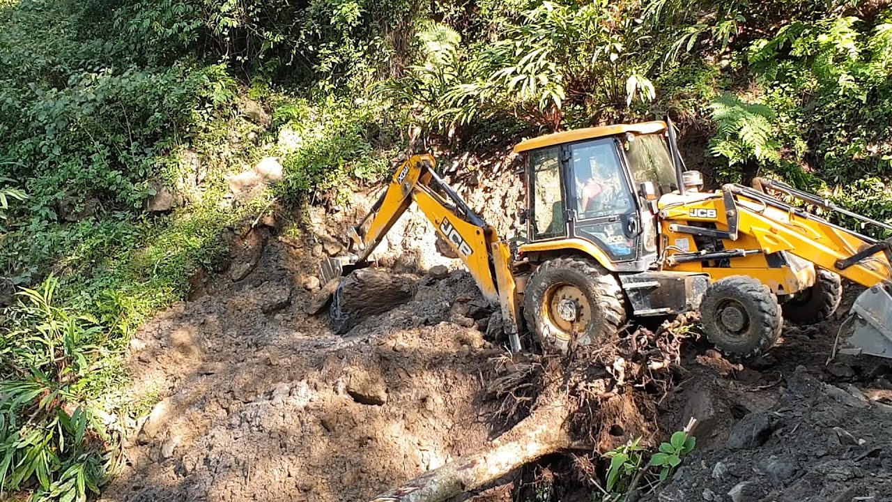 Struggling with Huge Buried Stone-JCB Backhoe Hilly Road Work - YouTube