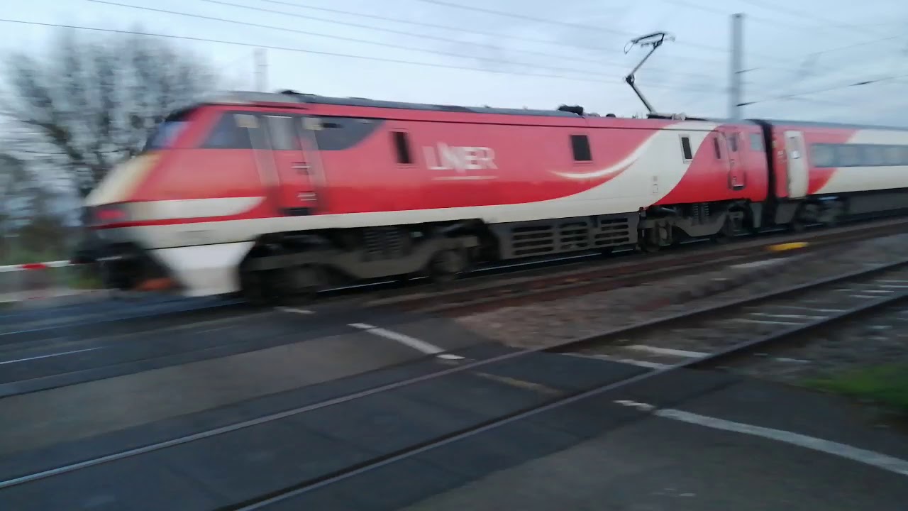 Trains at the level crossing+broken down train - YouTube